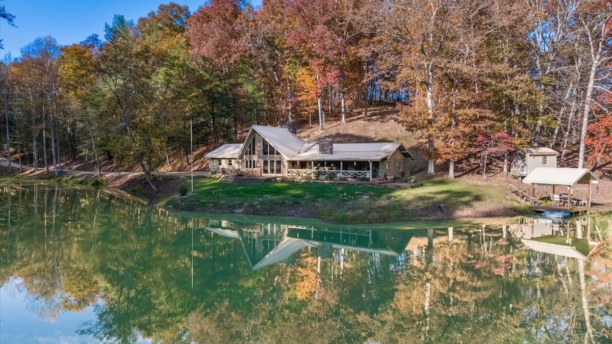 Beautiful Log Home Overlooking A Large Pond | Whitetail Properties