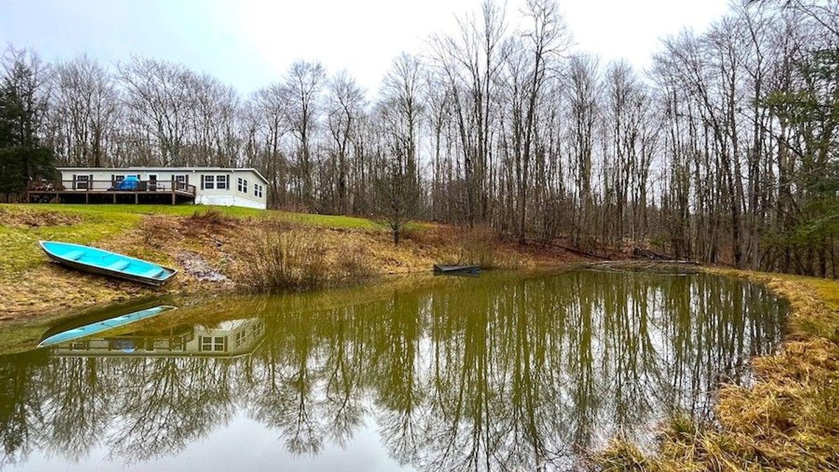 Hilltop Home With Deck Overlooking Pond In Wirt, NY | Whitetail Properties