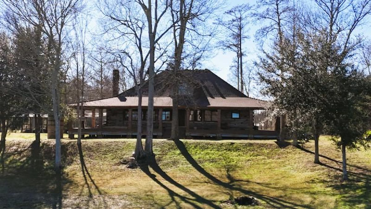 A Rare Riverfront Log Cabin Retreat In Butte La Rose | Whitetail Properties