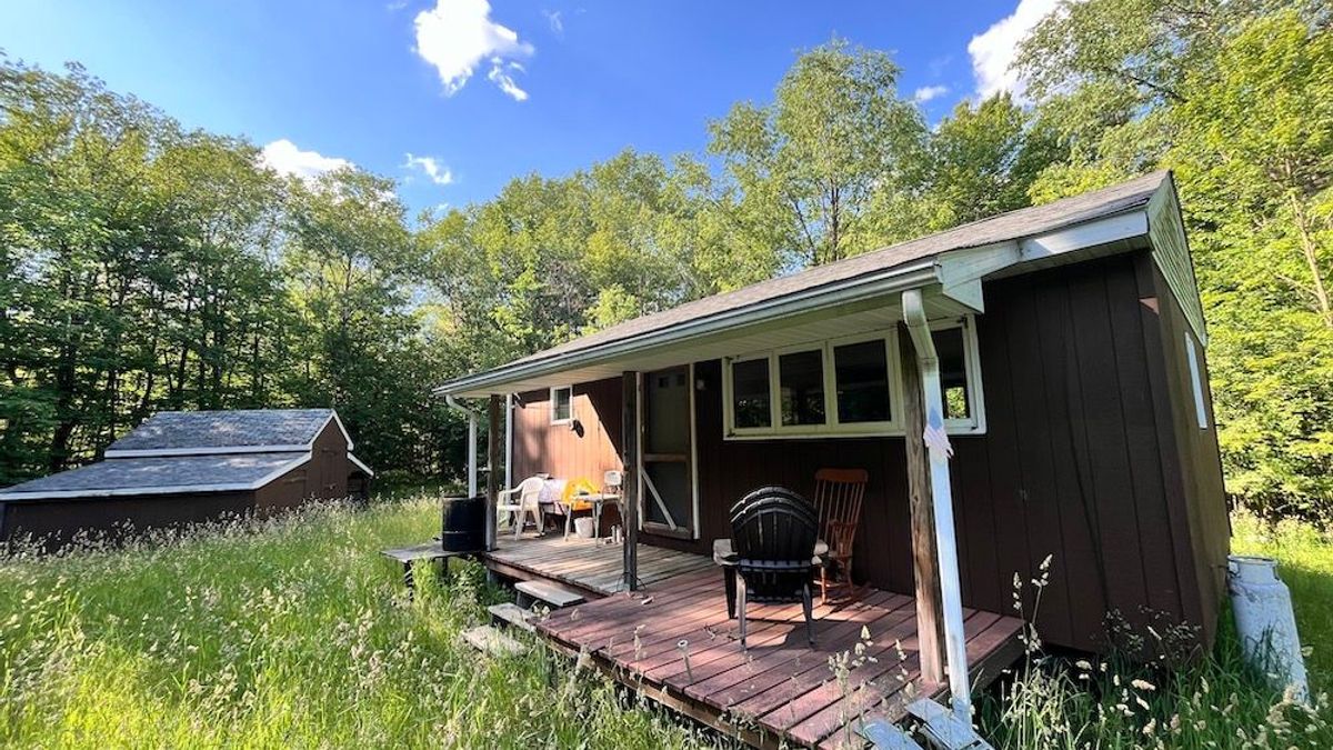Expansive Wooded Tract With Comfortable Off-Grid Camp And Garage ...