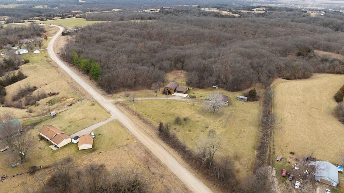 Split Level Home With Attached Garage, Outbuildings & Timbered Acres ...